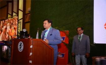 Dr. Rakesh Rao gives a keynote speech as a new product is unveiled ...